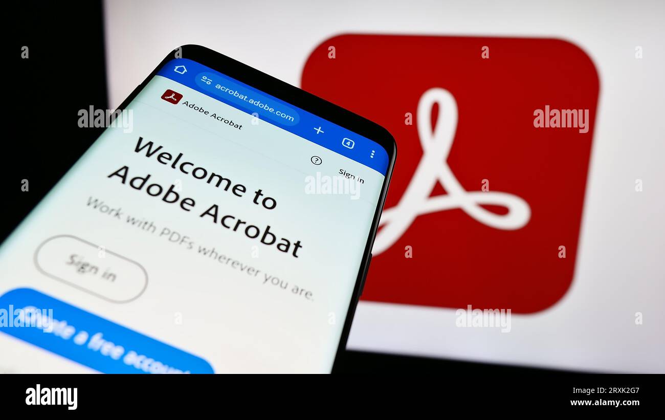 Mobile phone with website of PDF management software Adobe Acrobat on ...
