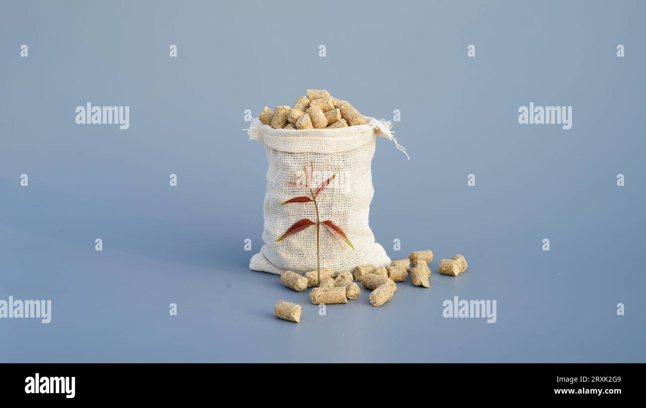 Burlap sacks or jute bag of granulated chicken feed isolated on gray ...