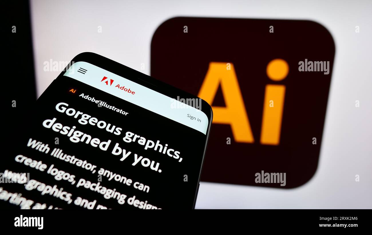 Mobile phone with website of vector graphics editor Adobe Illustrator ...