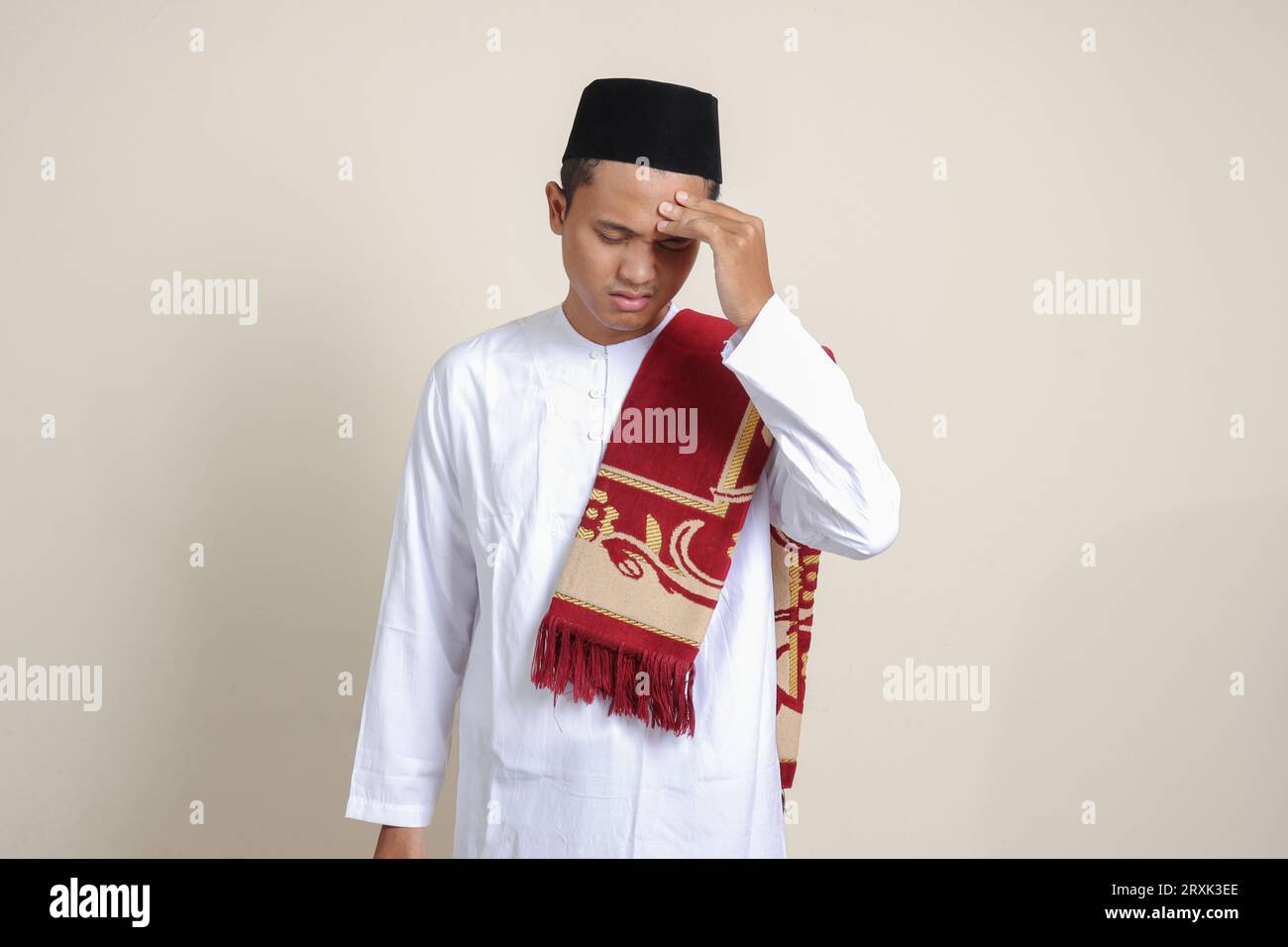 Portrait of attractive Asian muslim man in white shirt having a ... Portrait of attractive Asian muslim man in white shirt having a ...