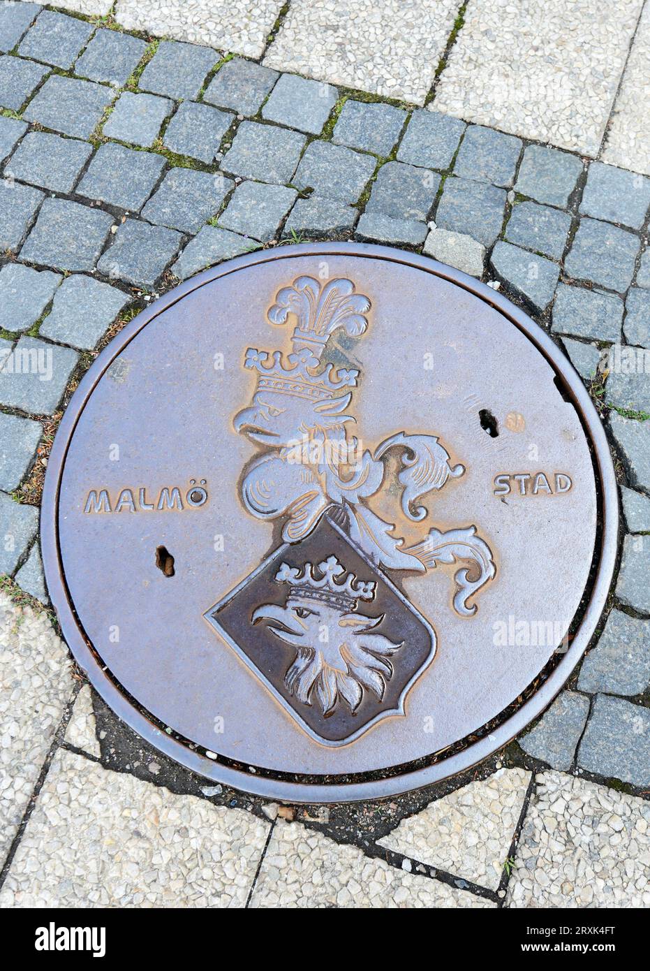 Malmö city manhole with the city's symbol Stock Photo - Alamy
