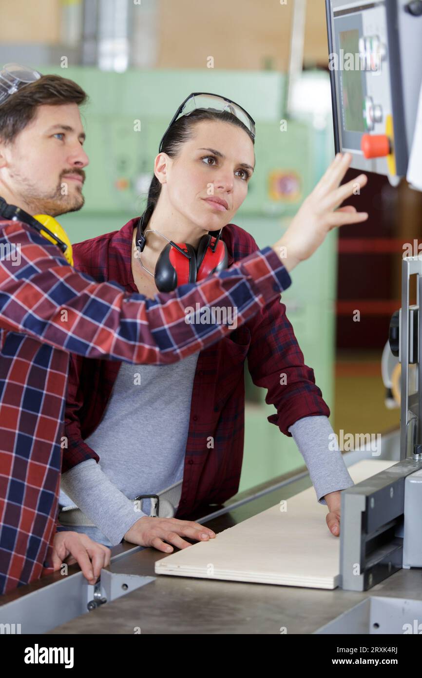 man and woman with machine cnc Stock Photo - Alamy