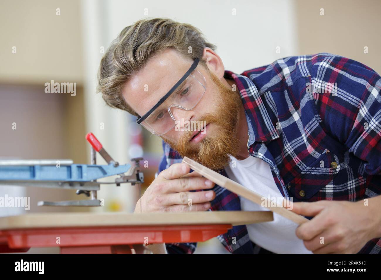 luthier controlling instruments fingerboard with care Stock Photo - Alamy