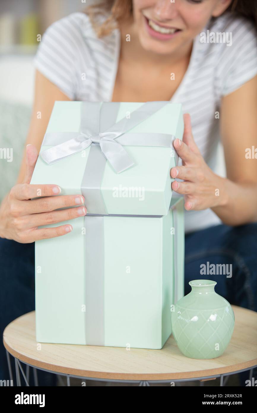 Lady opening box new hi-res stock photography and images - Alamy