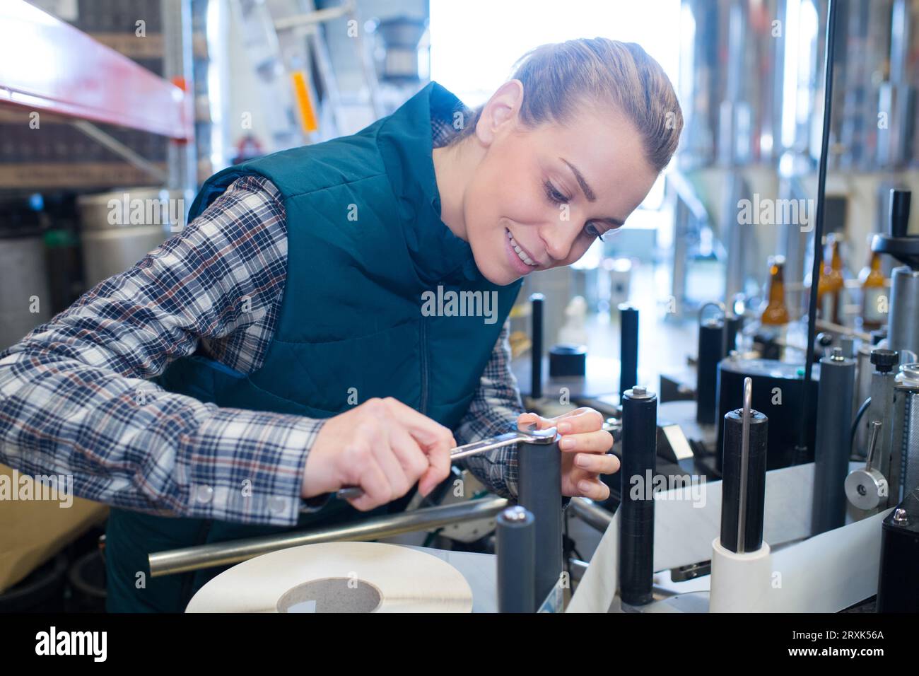 Worker setting up factory machine hi-res stock photography and images ...