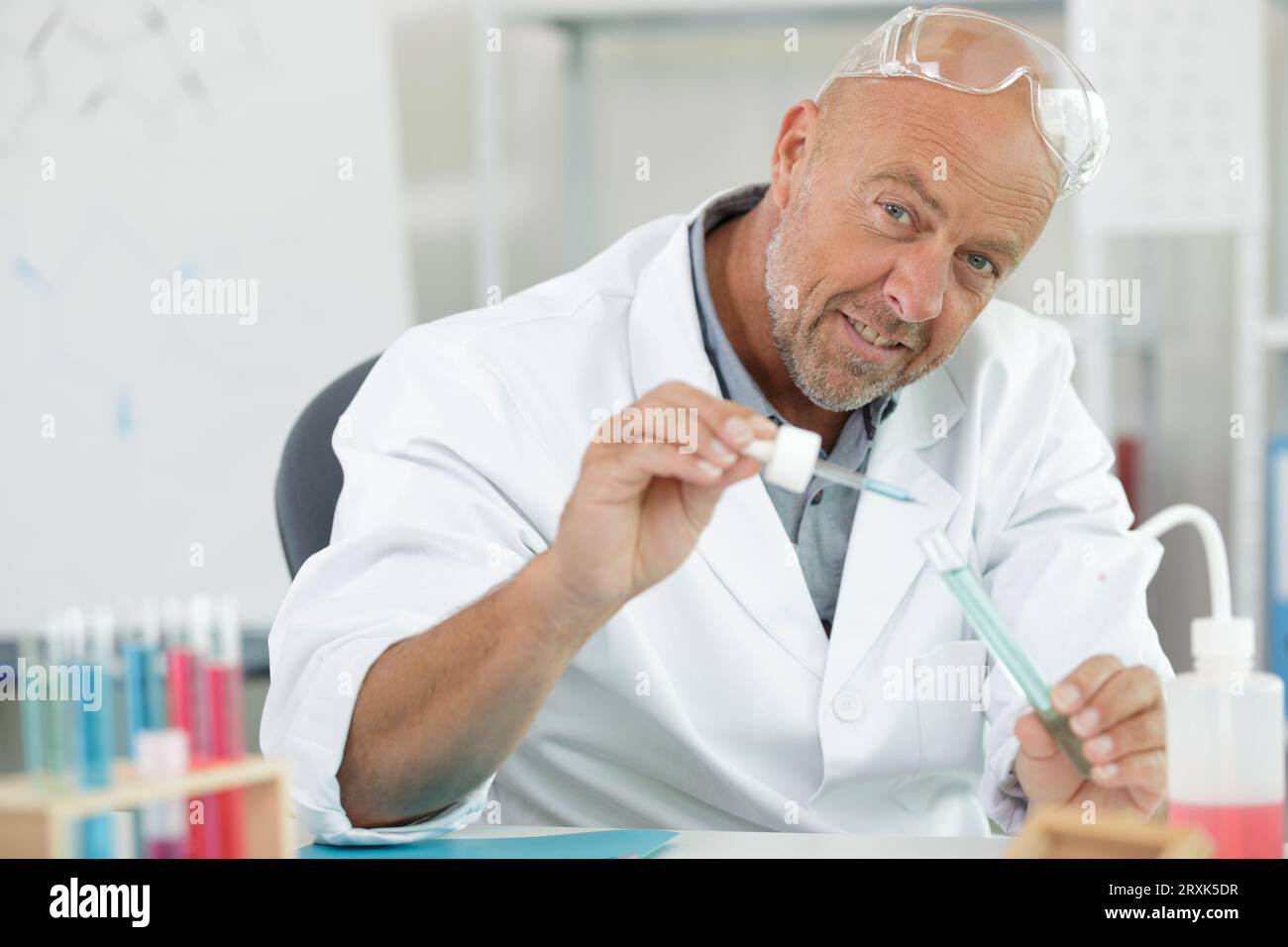 using a pipette while mixing chemical liquids Stock Photo - Alamy
