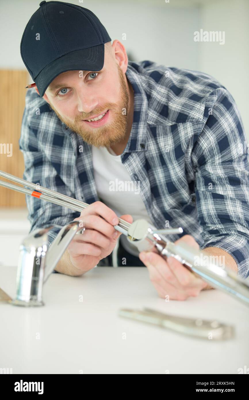 Man fixing sink pipe hi-res stock photography and images - Alamy