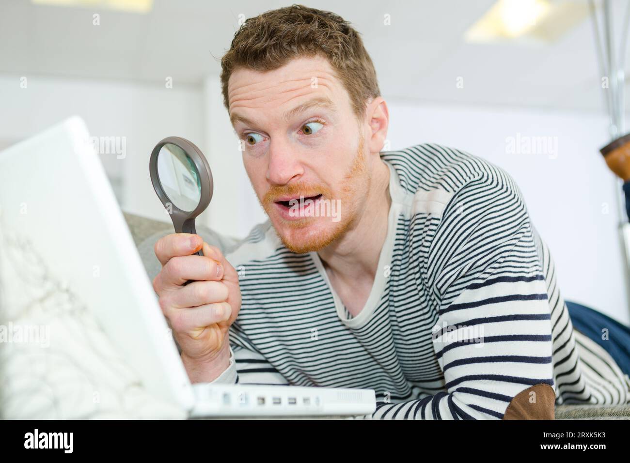 Man excitedly looking computer monitor hi-res stock photography and ...