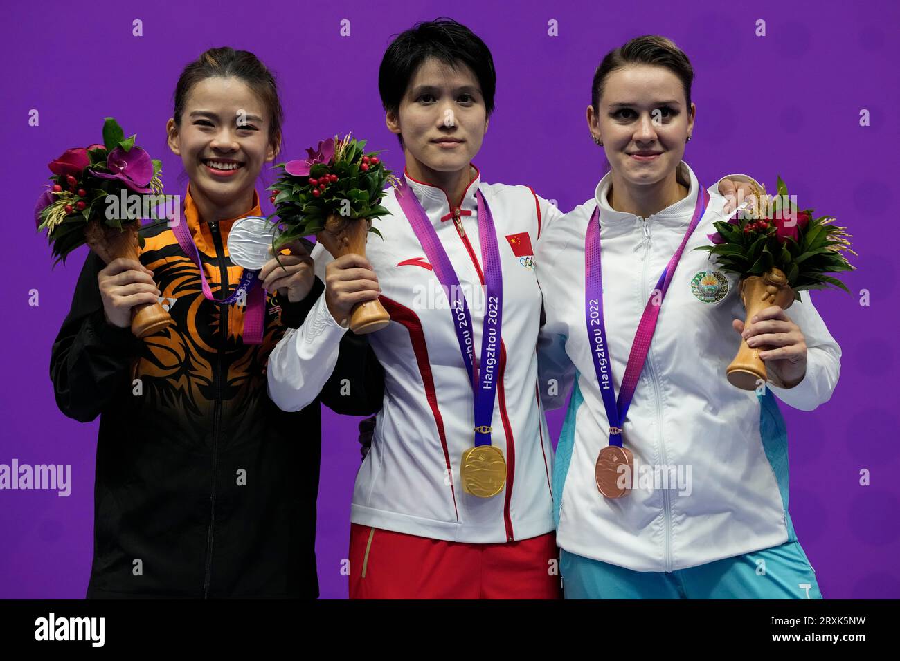 From left silver medalist Malaysia's Tan Cheong Min, gold medalist ...