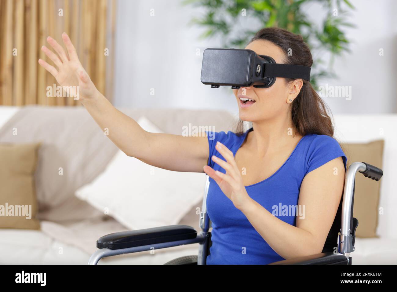 woman in wheelchair using virtual mask Stock Photo - Alamy