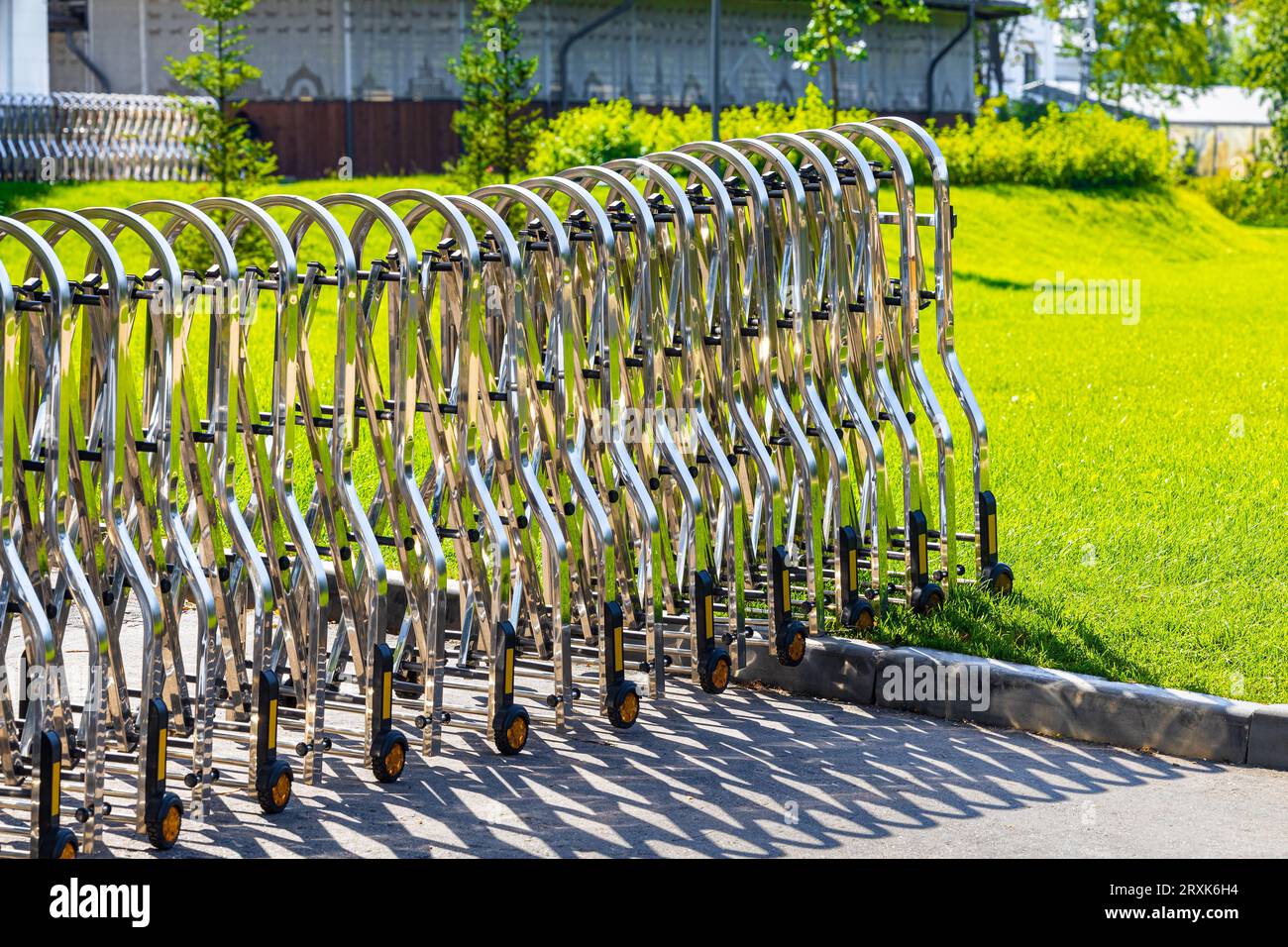 movable metal railing on wheels on the street Stock Photo - Alamy