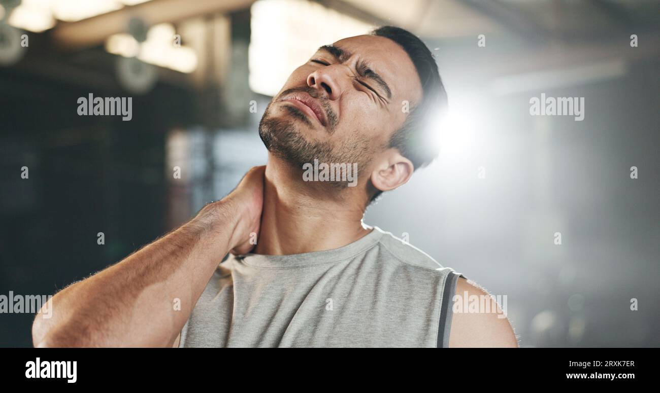 Fitness, neck pain and face of man at gym for training with muscle ...