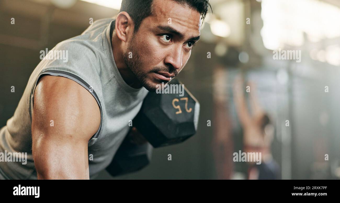Serious man, dumbbell and weightlifting in workout, exercise or fitness ...