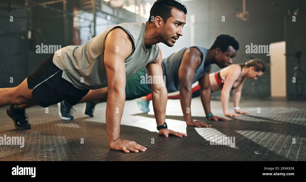 Gym, group fitness and push up exercise for power, sports challenge and ...