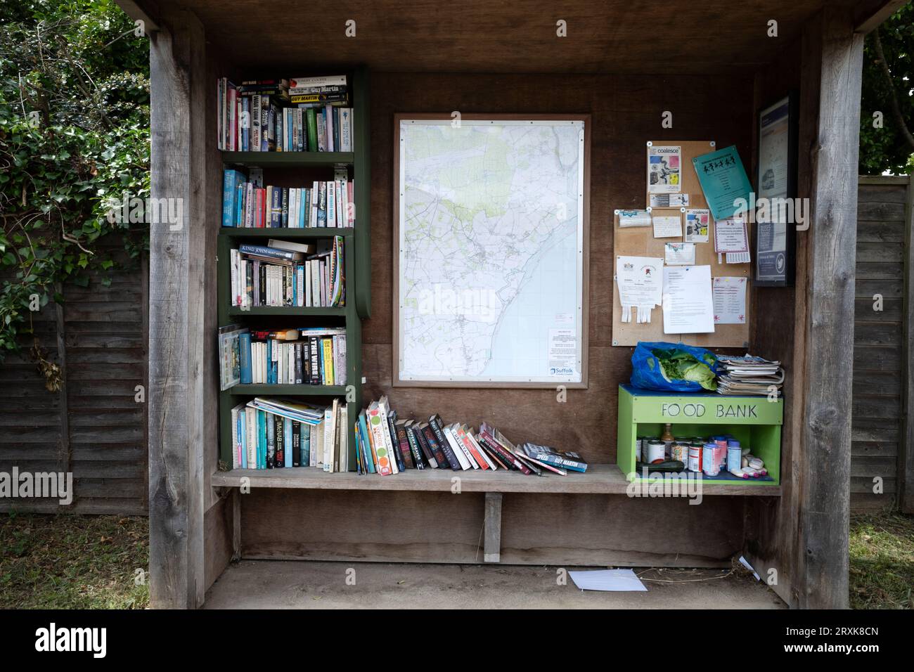 Library and food bank in a former bus shelter Hollesely Suffolk Stock ...
