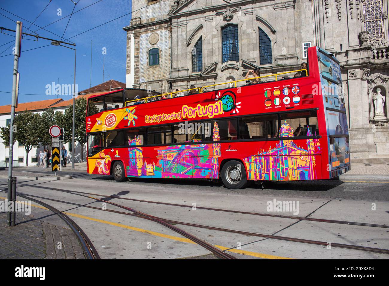 red touristic sightseeing bus in Porto. Guide bus on Porto streets ...