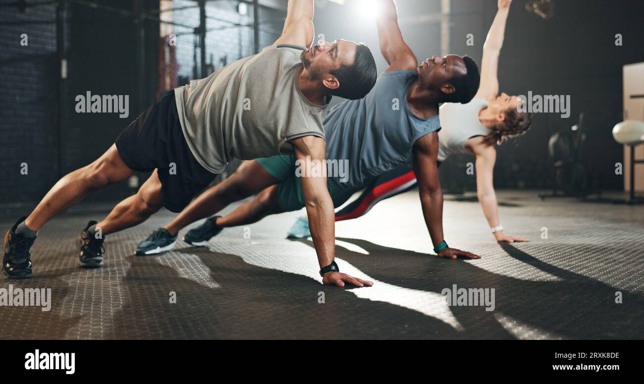 Gym, men and women in floor exercise for strong body, muscle ...