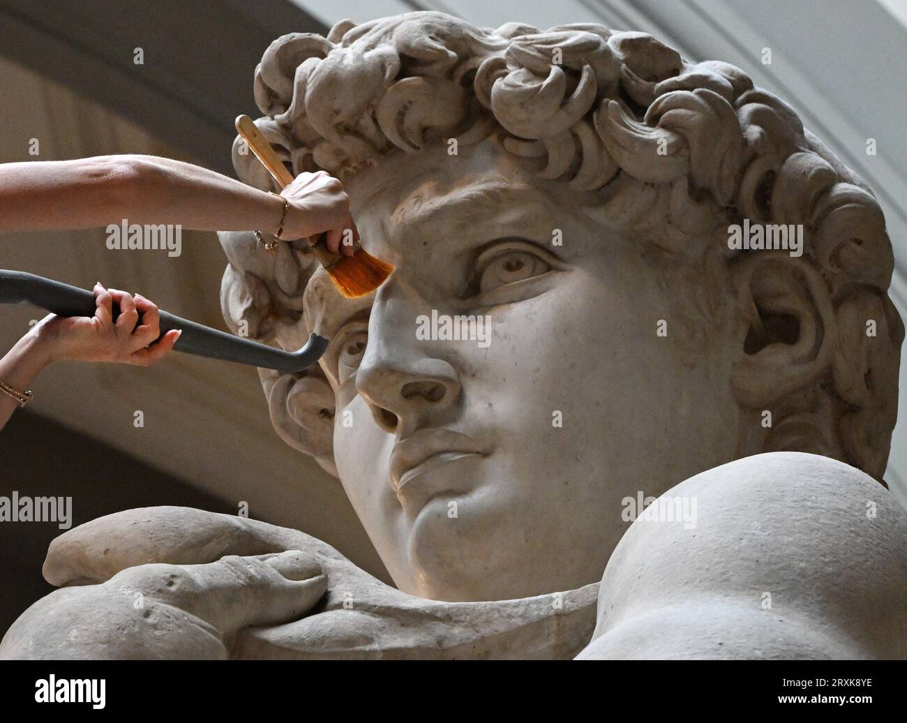 Italian Restorer Eleonora Pucci cleans dust and debris off Michelangelo ...