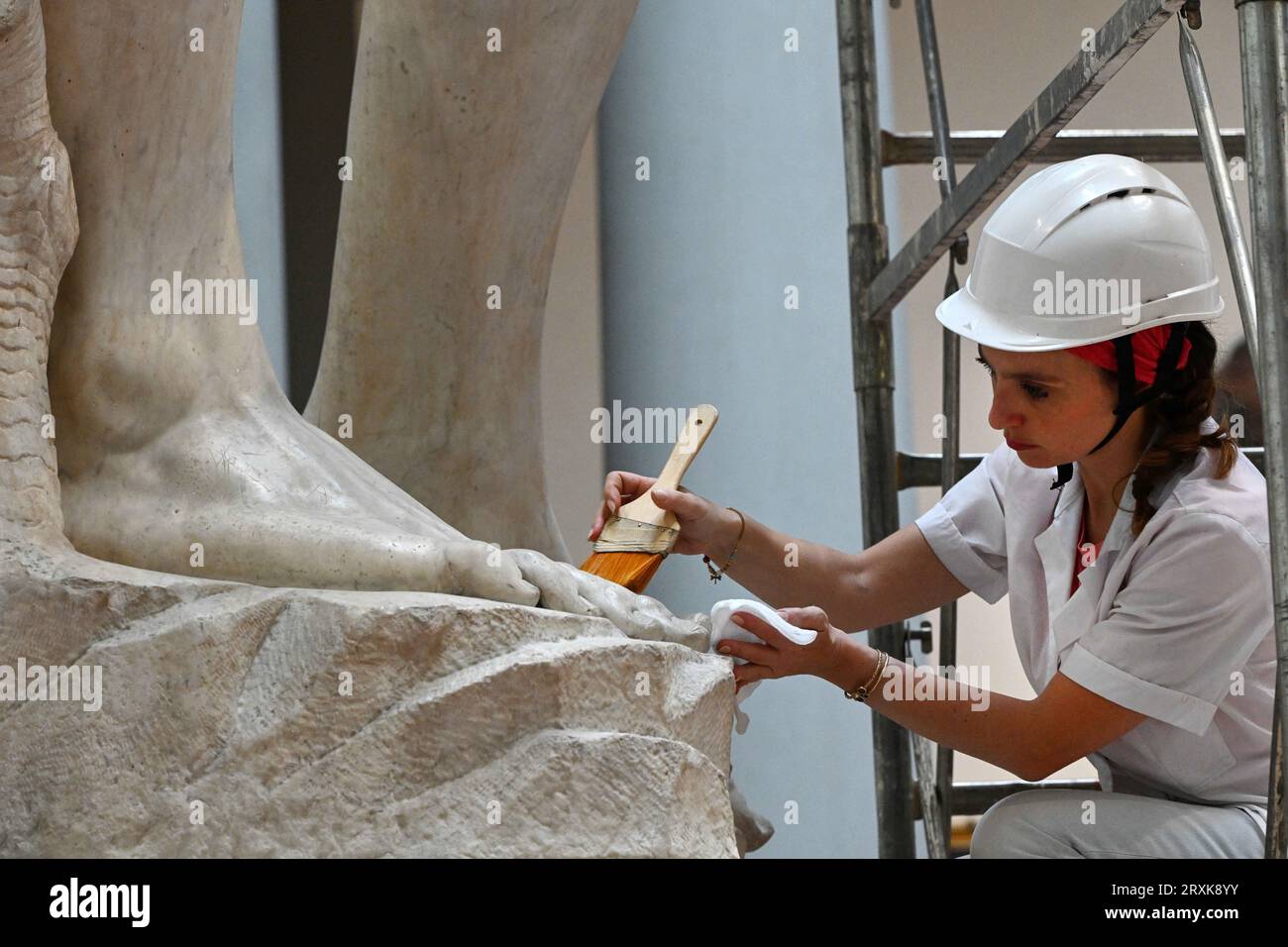 Italian Restorer Eleonora Pucci cleans dust and debris off Michelangelo ...