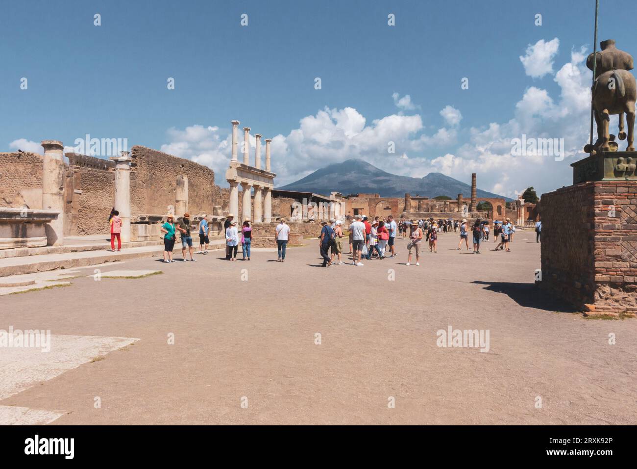 Ancient square against volcano Vesuvius with tourists in Pompeii, Italy ...