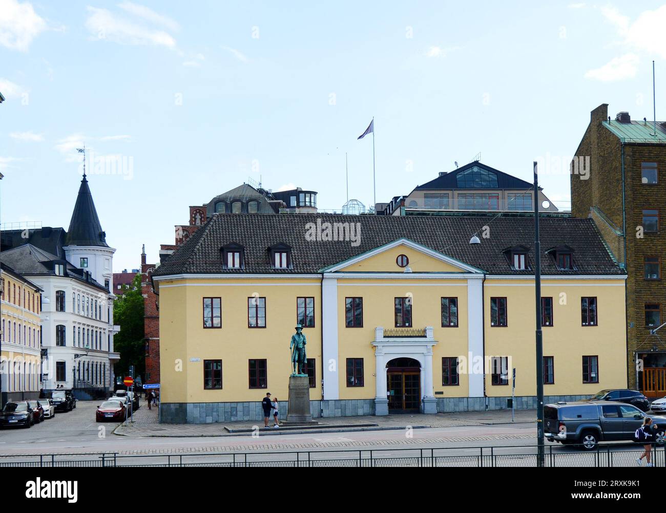 Frans Suell Monument with a beautiful old building in Malmö, Sweden ...