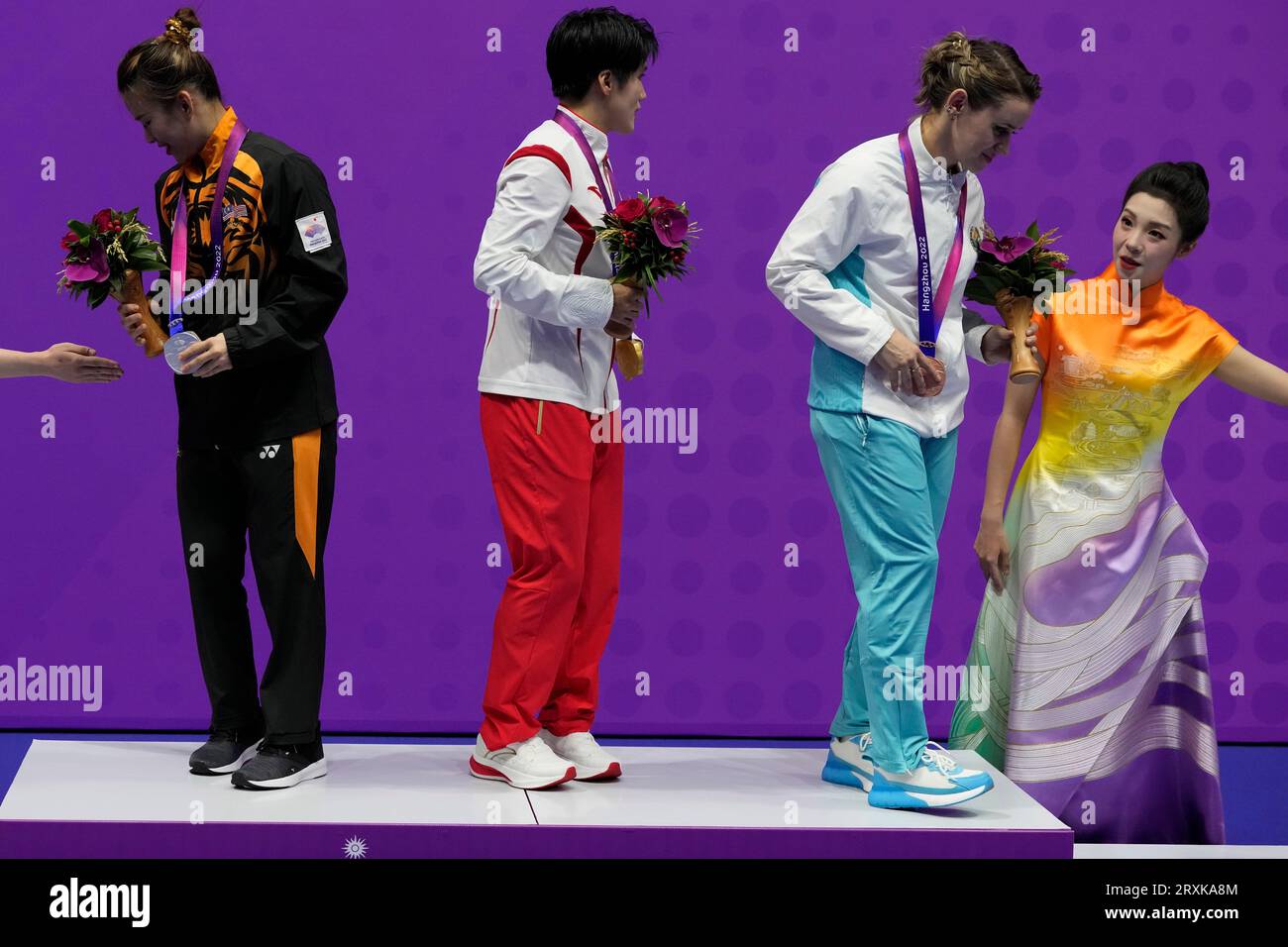 From left silver medalist Malaysia's Tan Cheong Min, gold medalist ...