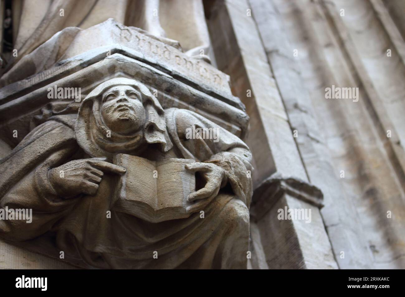 Stone sculpture on ancient cathedral in Europe. Gargoyle face. Catholic ...