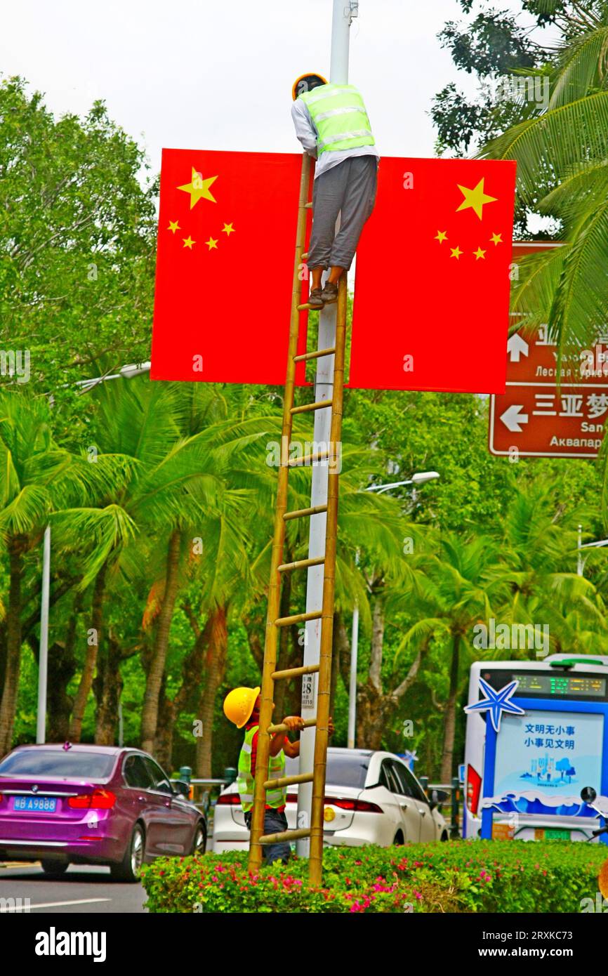 National flags are hung up to welcome the National Day in Sanya City ...