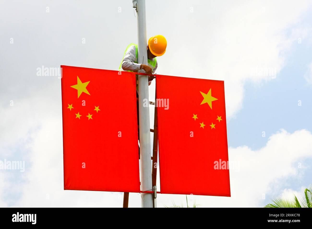 National flags are hung up to welcome the National Day in Sanya City ...