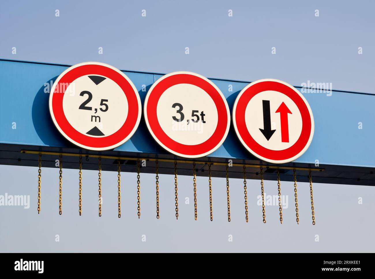 Three traffic signs on a bridge construction Stock Photo - Alamy