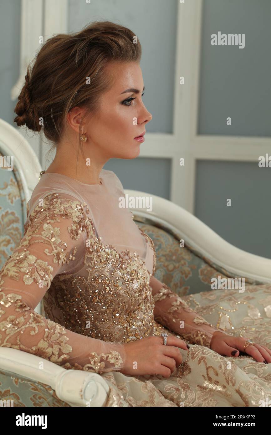 Gorgeous fashion model woman in perfect gold evening gown portrait ...
