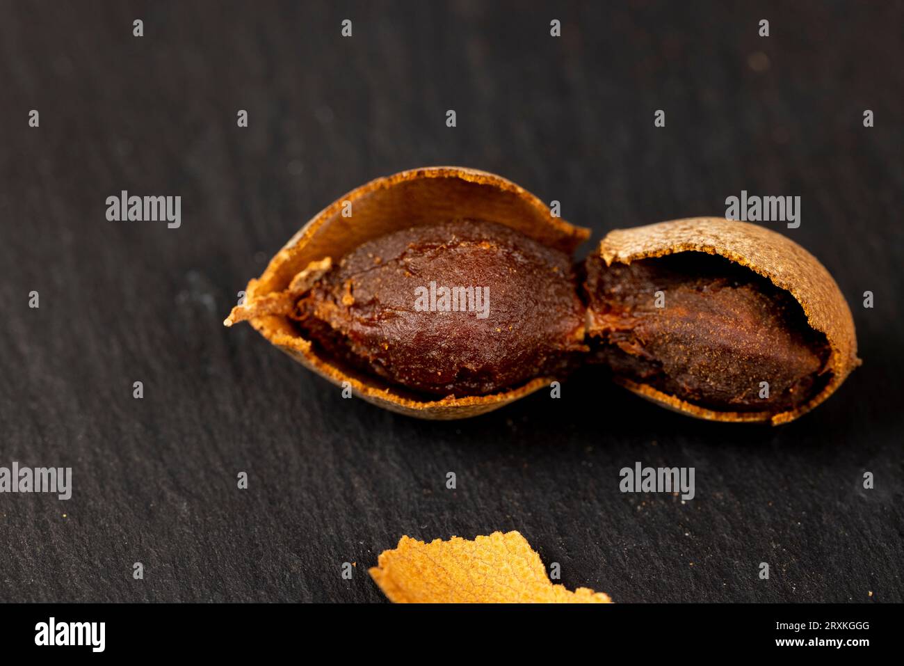 open ripe tamarind pods with edible pulp, ready-to-eat whole tamarind ...