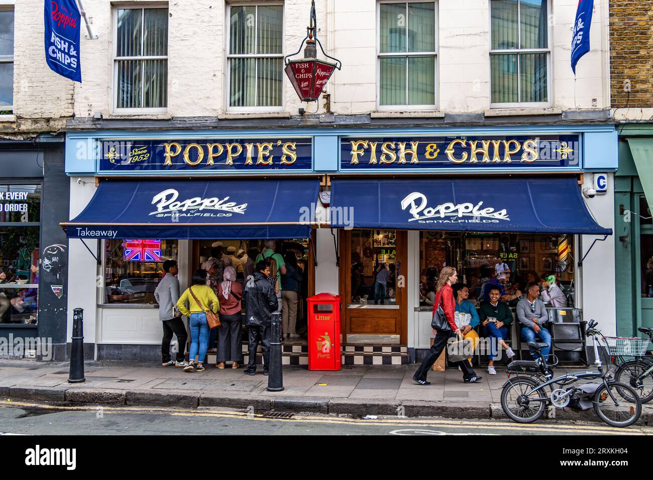 People buying fish and chips at Poppies Fish & Chip shop Spitalfields ...