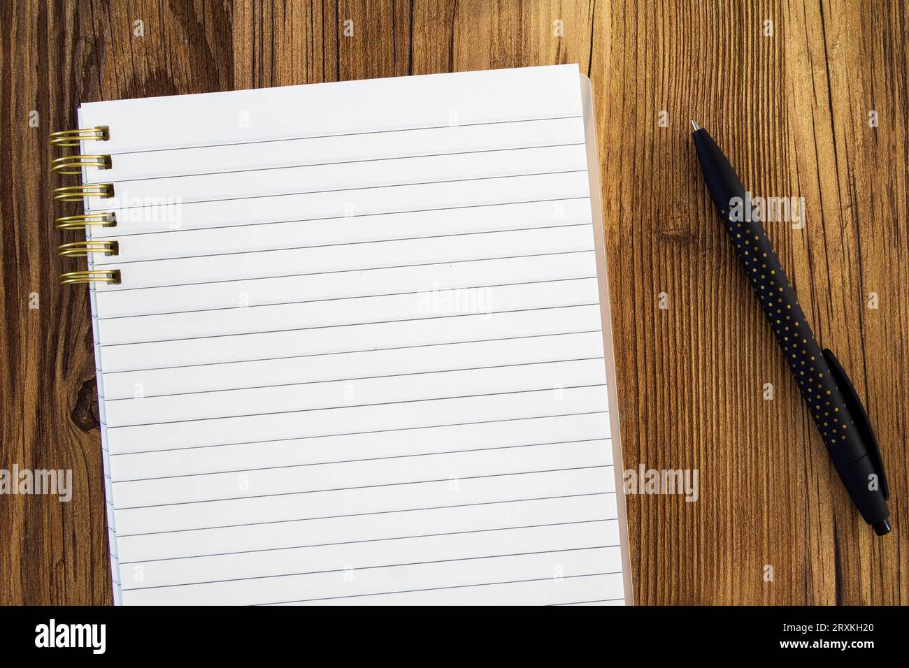 lined blank note pad mock up with black pen on wooden background Stock ...