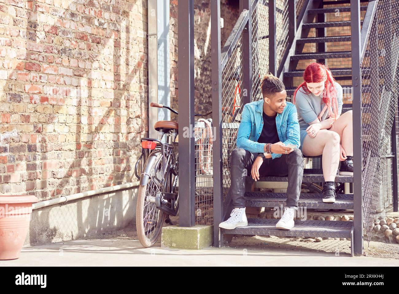 Boys girls sitting steps smiling hi-res stock photography and images ...