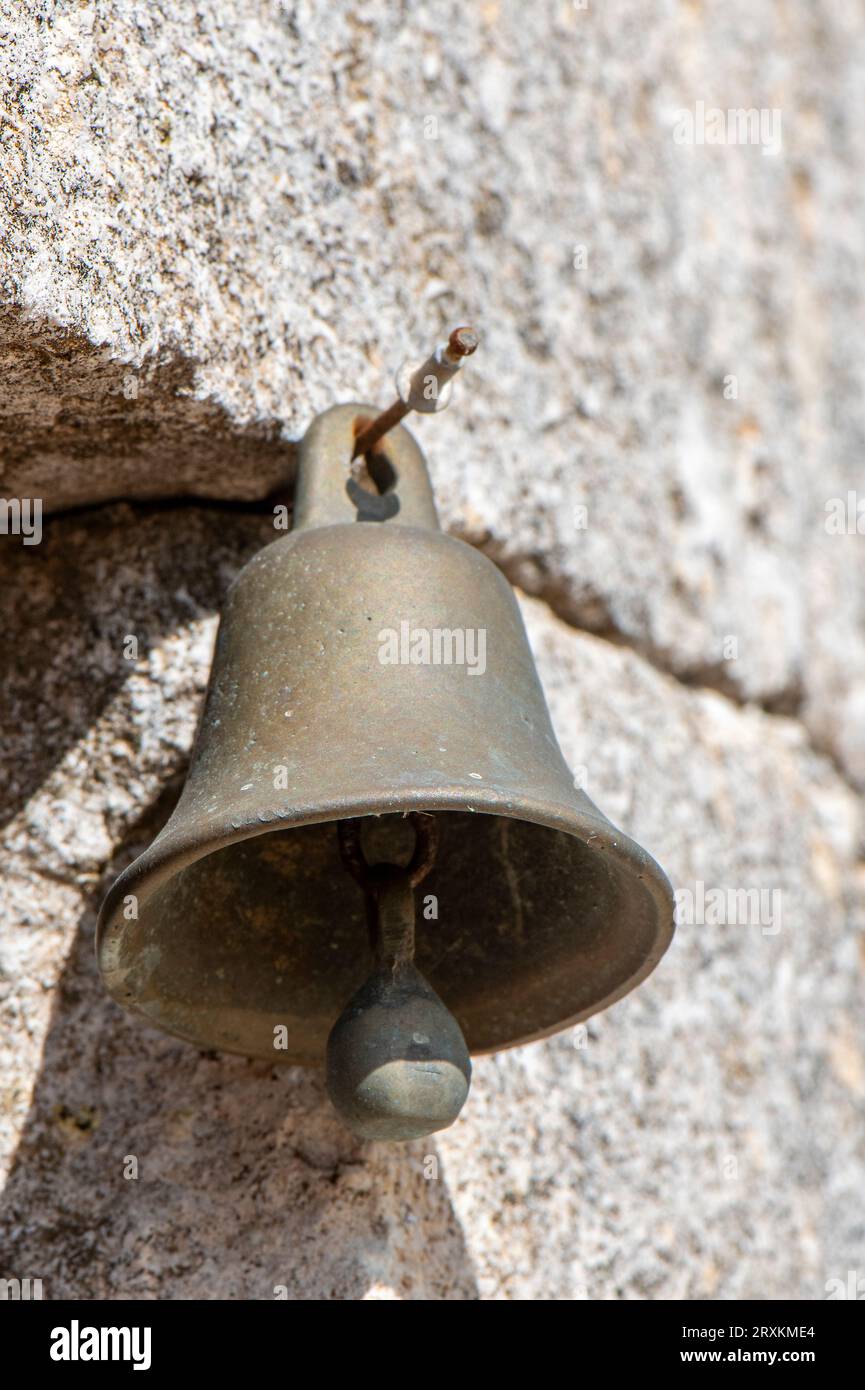brass bell hanging on the outside of a house, door bell, ringing bell ...
