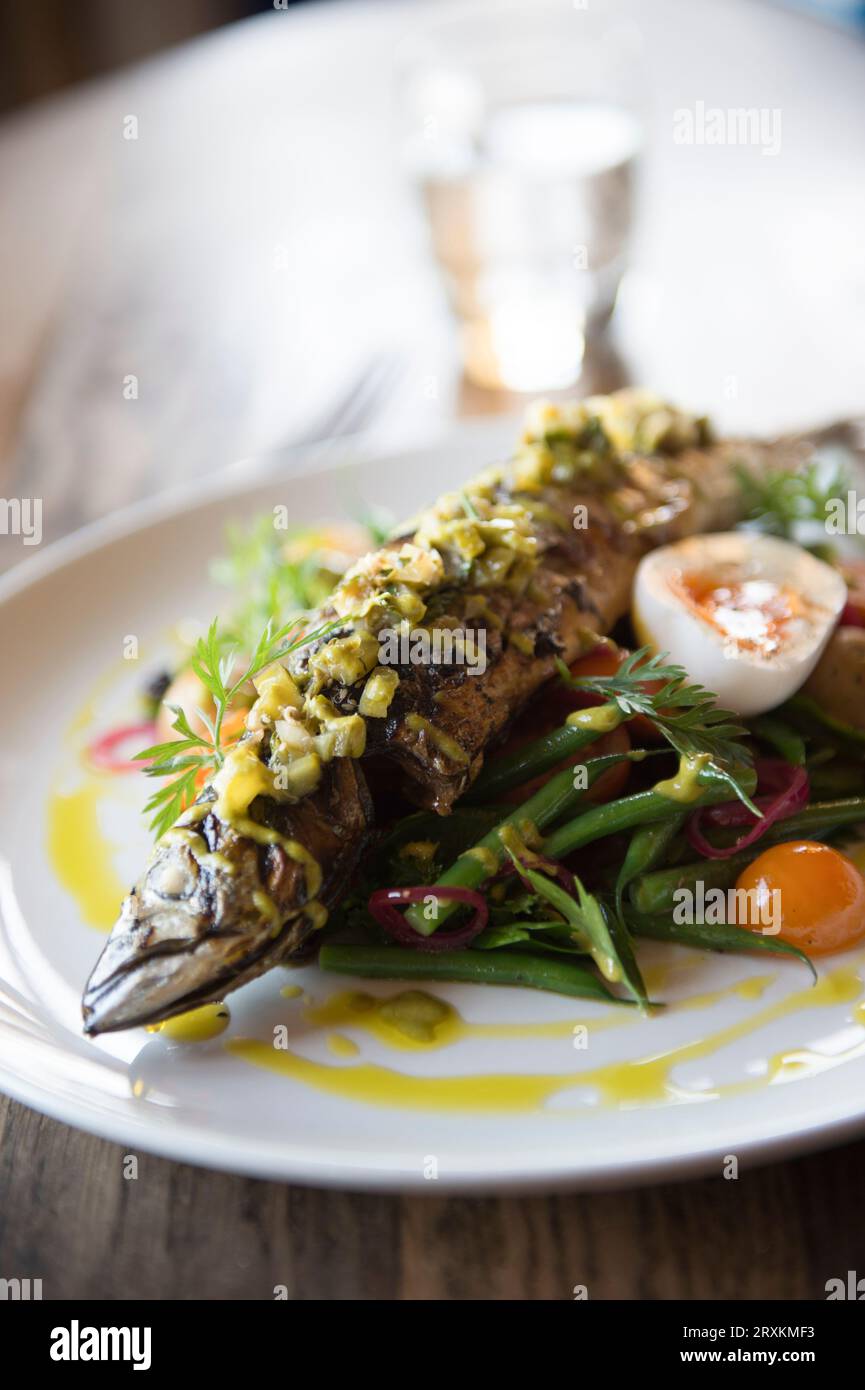 Gourmet dish with fish and salad at Gurnards Head in Cornwall Stock ...