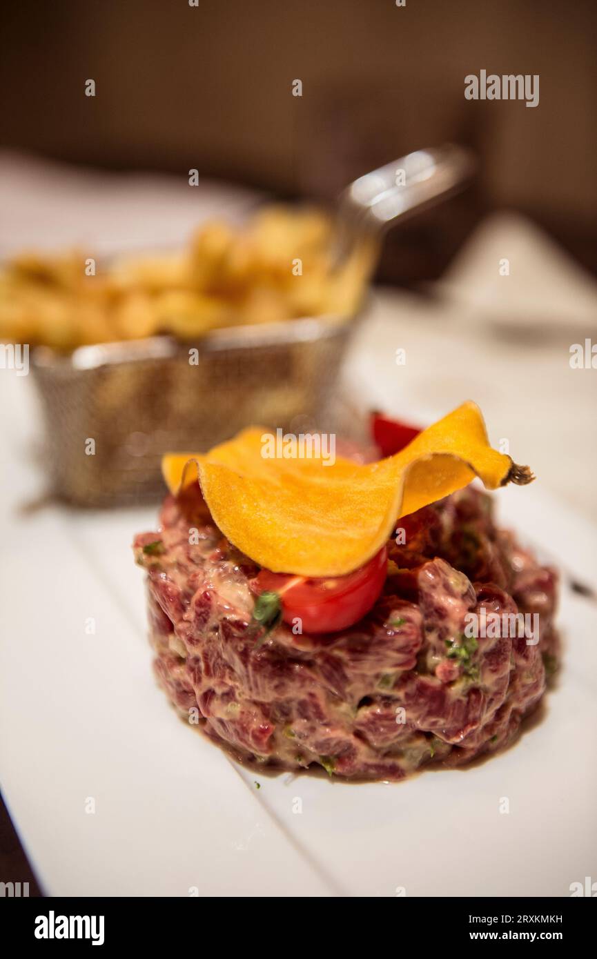 Gourmet meat dish served with garnish Stock Photo - Alamy