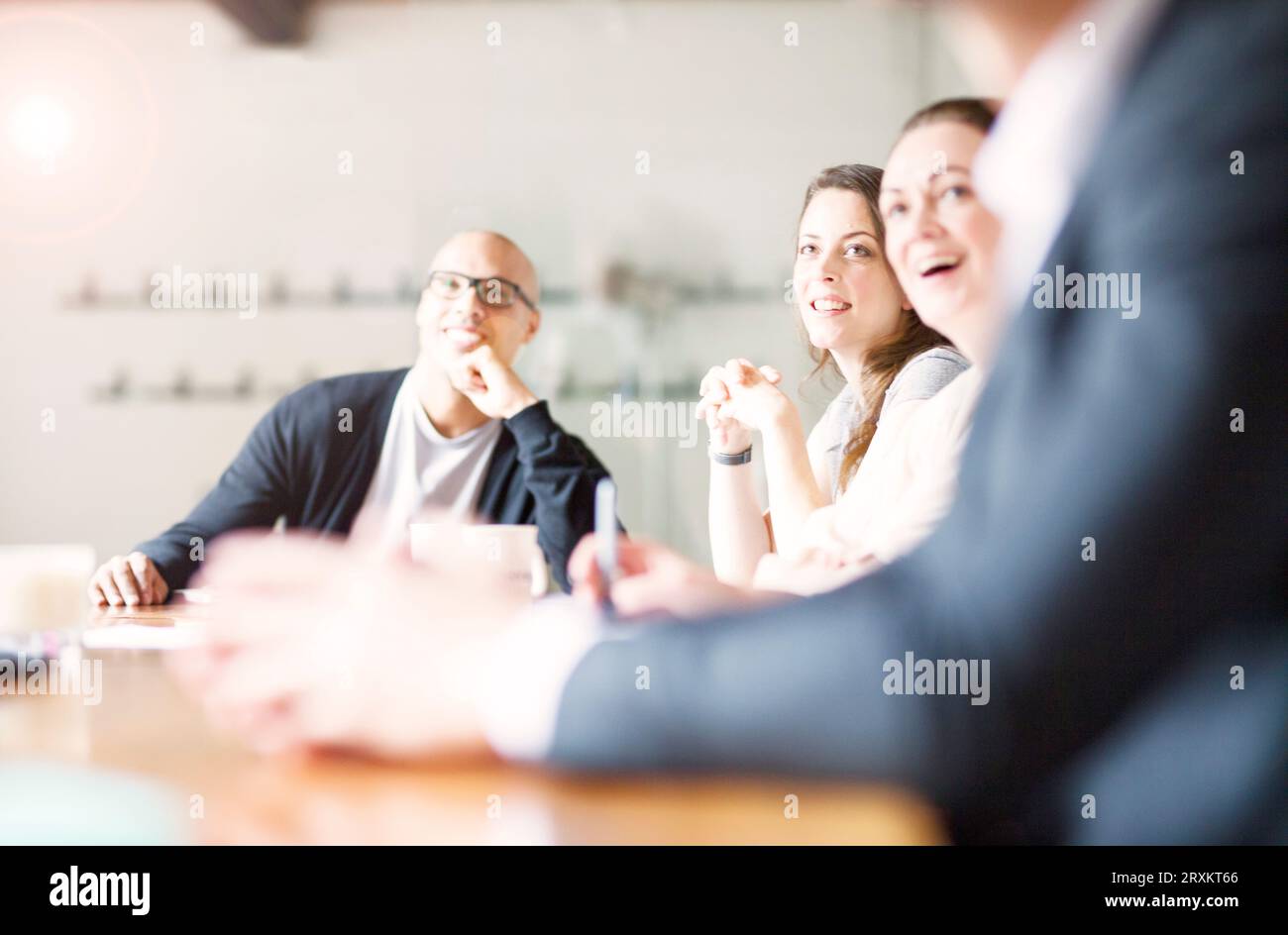 Businesspeople listening during meeting in conference room Stock Photo ...
