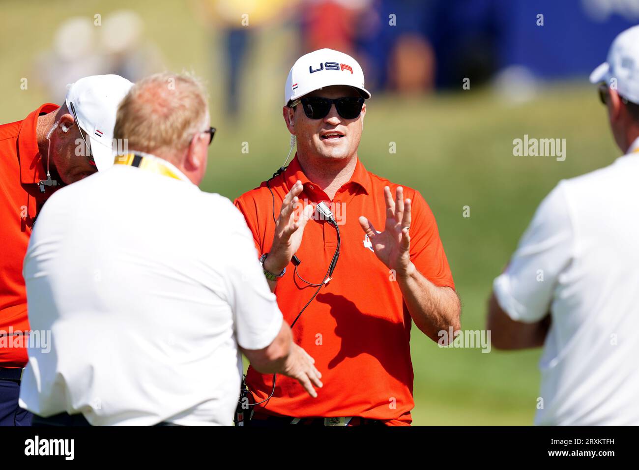 USA Captain Zach Johnson in conversation with officials as he watches ...