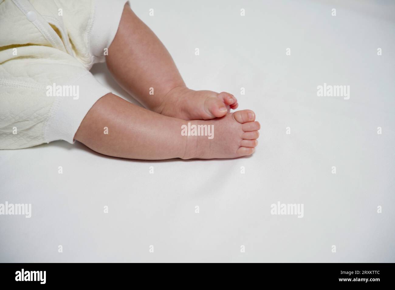 Fat calves and feet of infants Stock Photo - Alamy