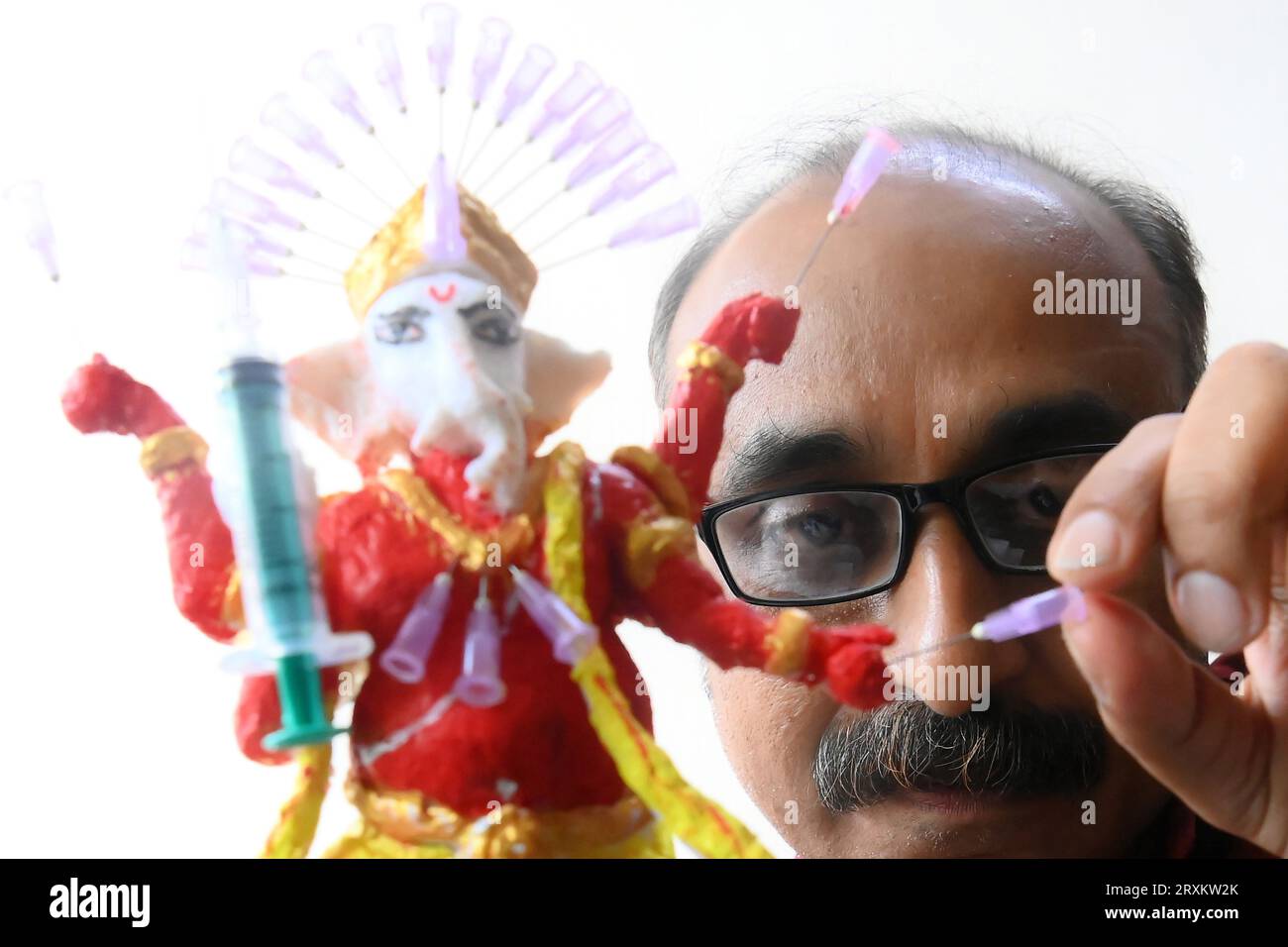 Samiran De, an artist works on an idol of Lord Ganesha made with soup ...