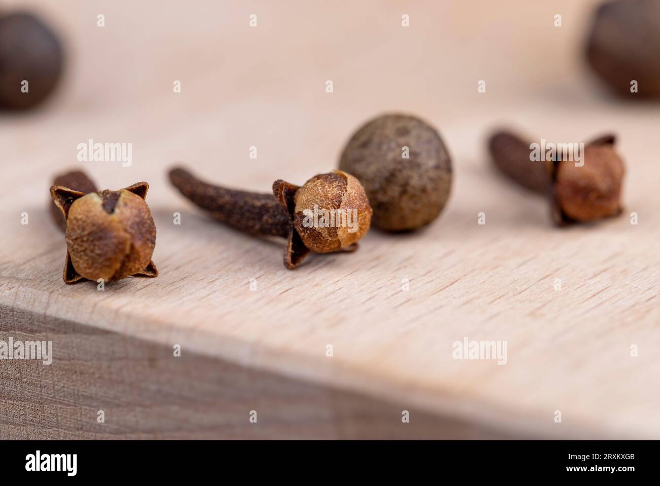 Spices of cloves on a piece board, a small amount of mixed spices Stock ...