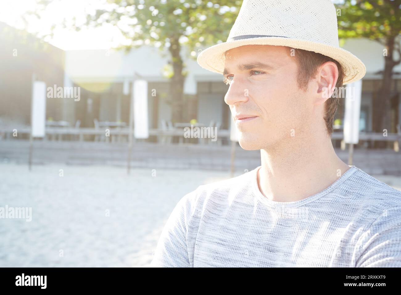 Young man wearing straw trilby hat on beach Stock Photo - Alamy
