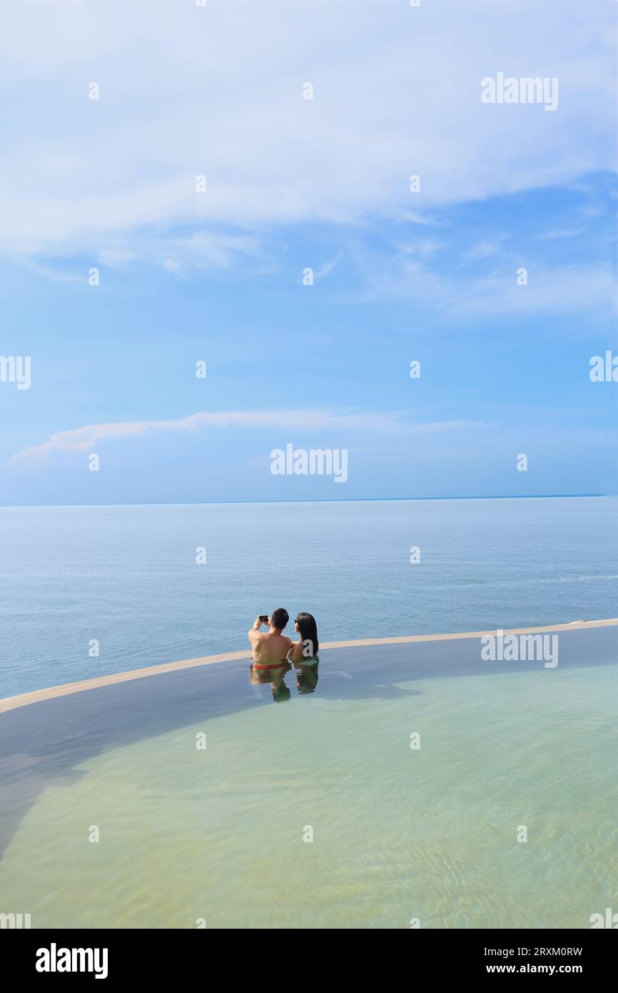 Young adult couples in swimming pool hi-res stock photography and ...