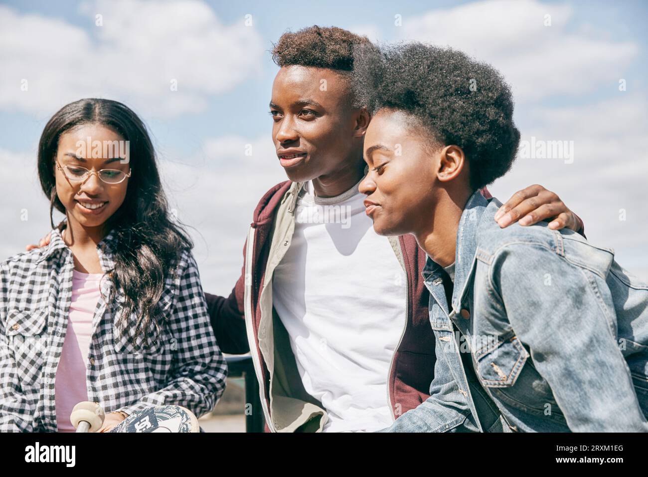 Teenage friends talking together Stock Photo - Alamy