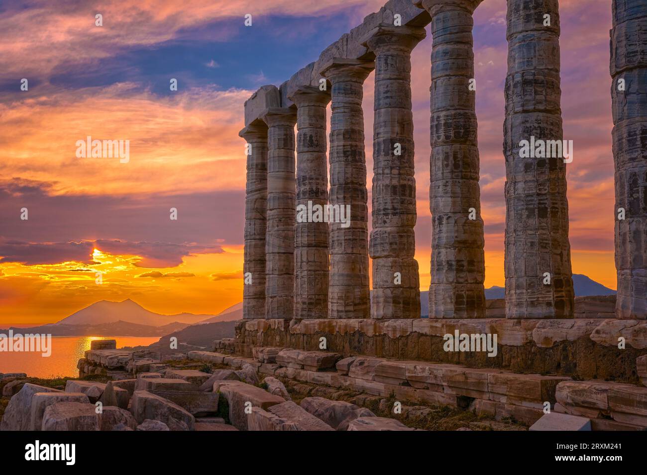 Beautiful sunset sky and ancient ruins of temple of Poseidon, cape ...