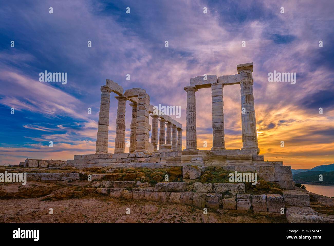 Beautiful sunset sky and ancient ruins of temple of Poseidon, cape ...