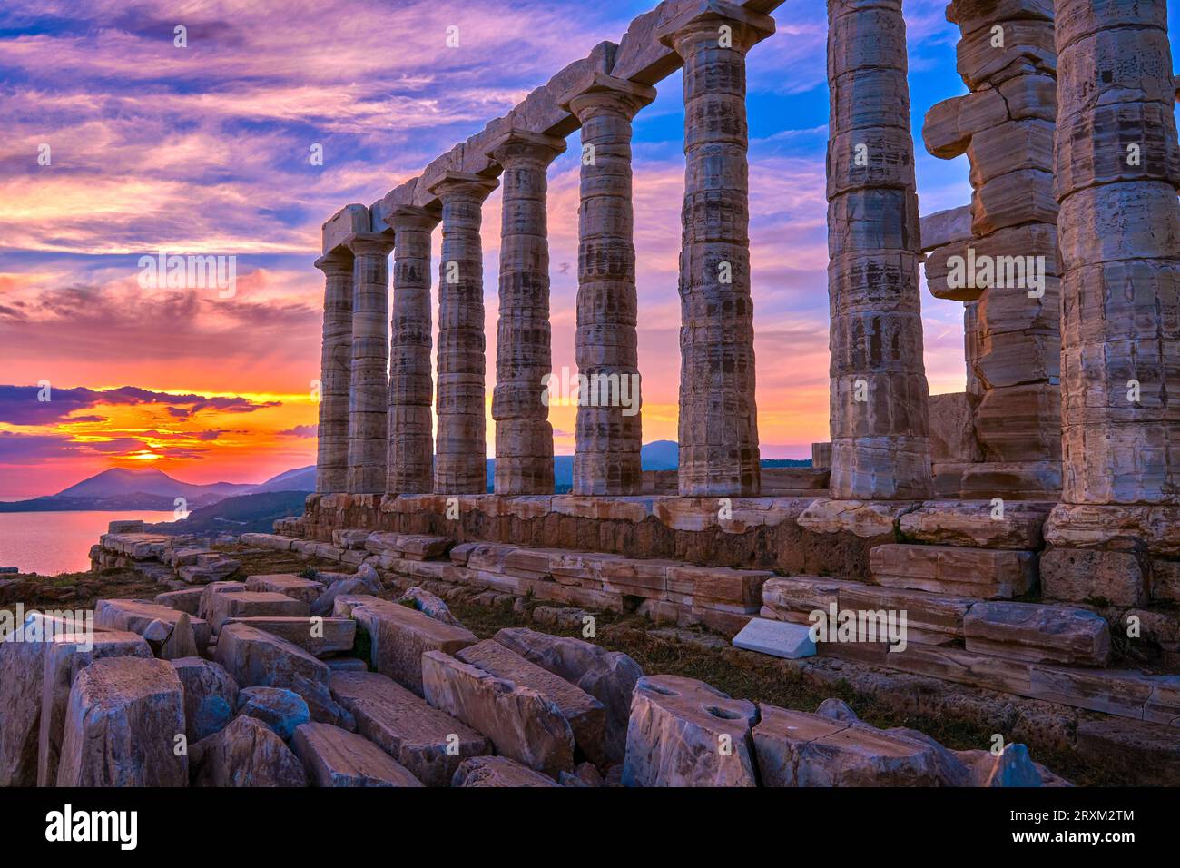 Beautiful sunset sky and ancient ruins of temple of Poseidon, cape ...
