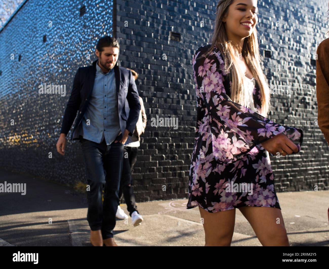 Man walking woman along pavement hi-res stock photography and images ...